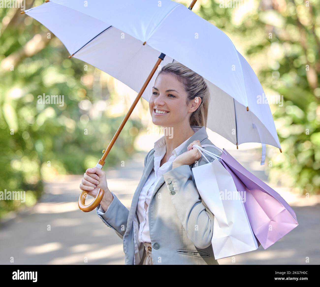 Sun, umbrella and woman with bags from shopping with smile and happy ...