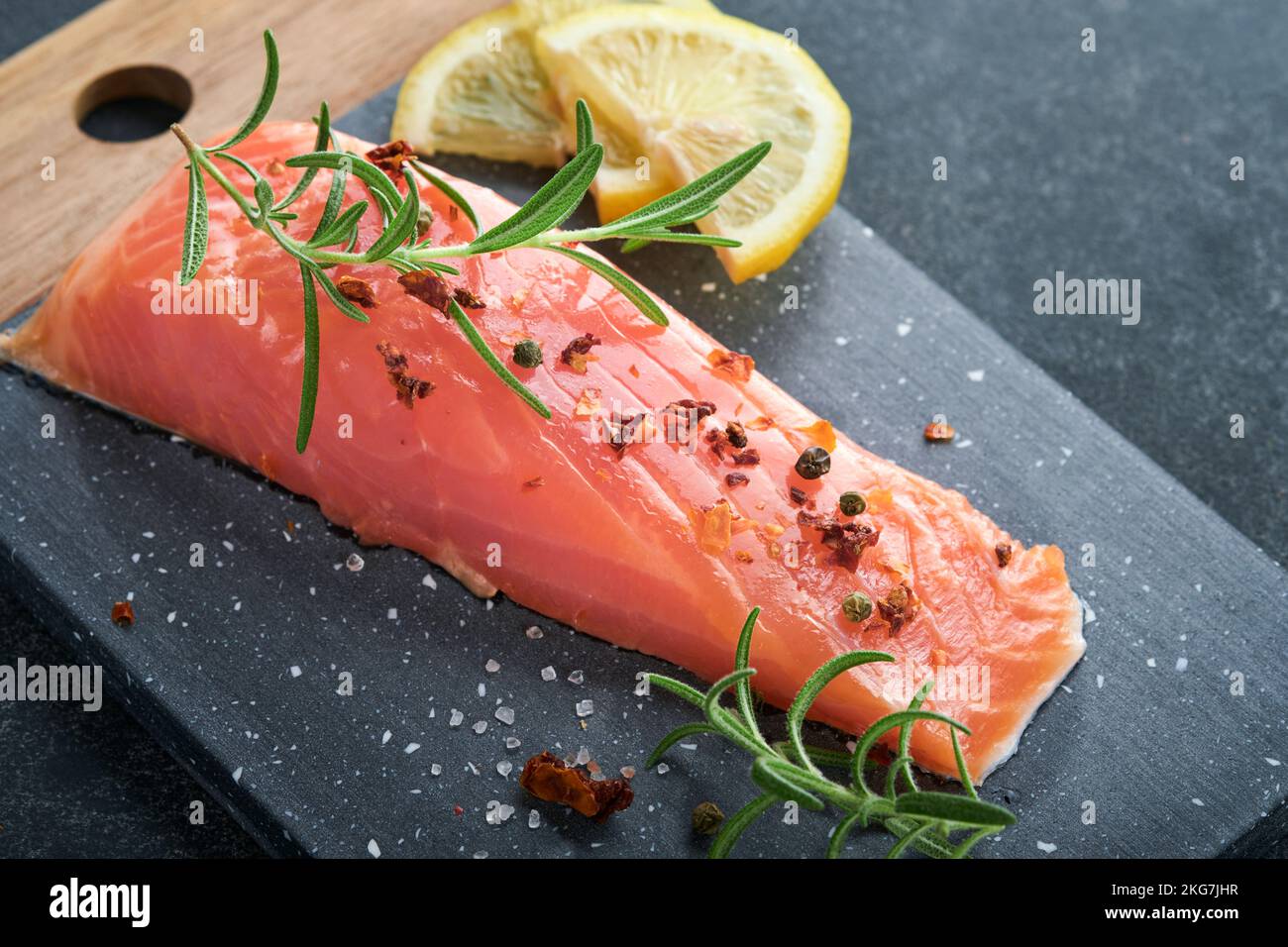 Salmon fish piece. Fresh raw salmon fish piece on marble board stand ...