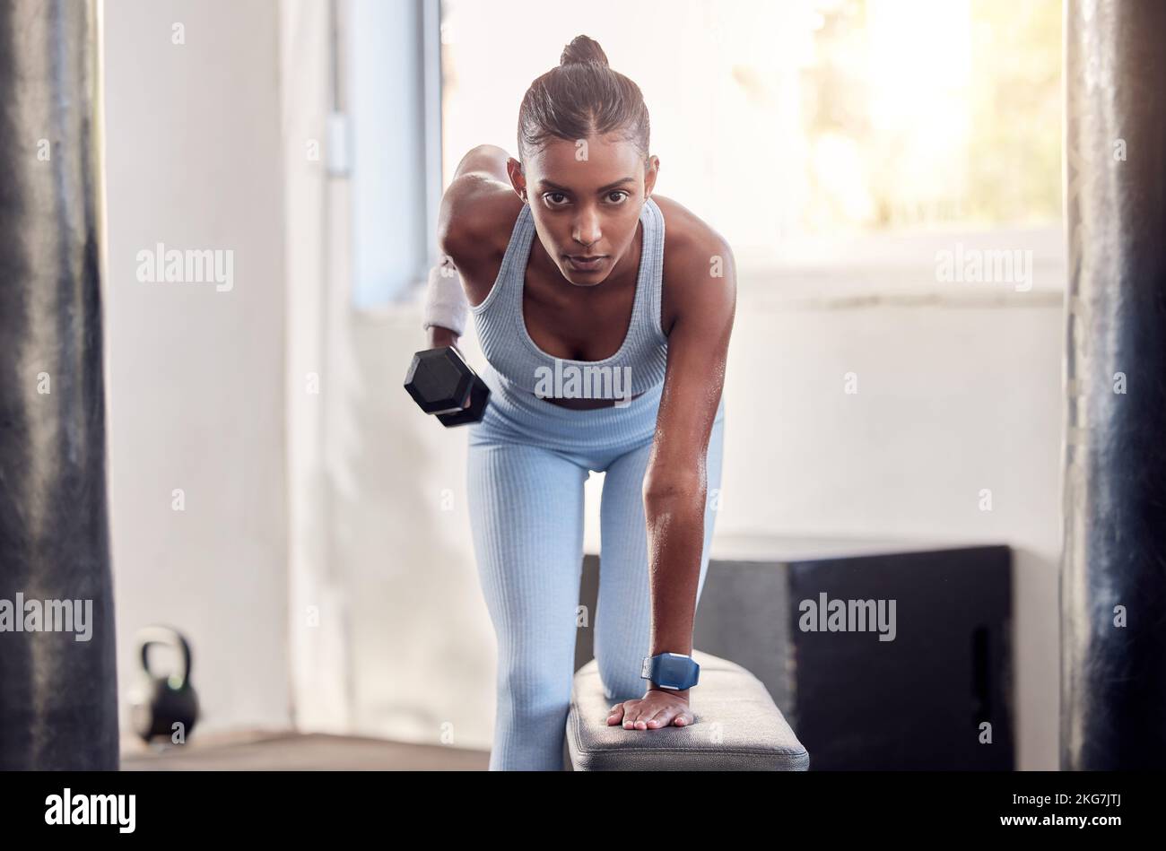 Fitness, dumbbell weight and black woman doing a workout for strength ...