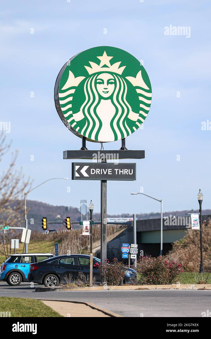A large sign with the Starbucks logo is seen at its coffeehouse in ...
