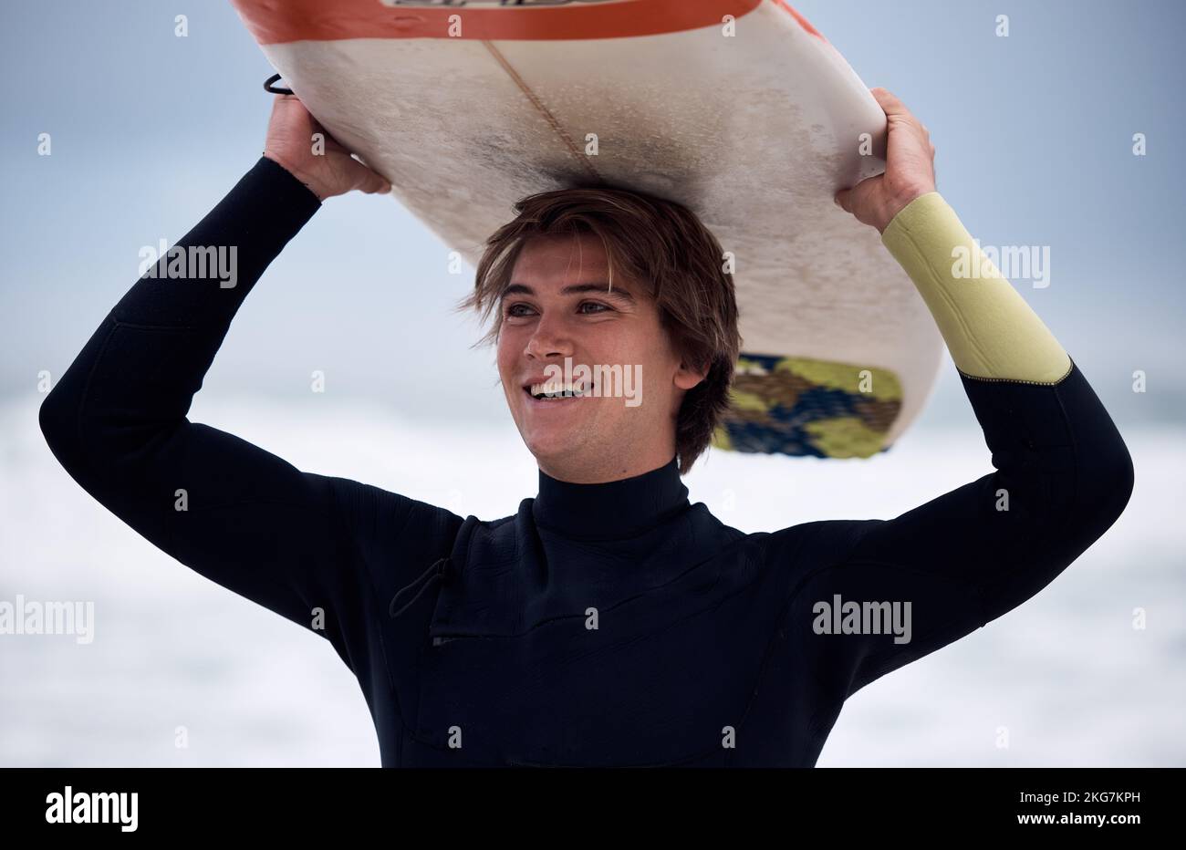 Ocean, surfer and man carrying surfboard on holiday, vacation or summer ...