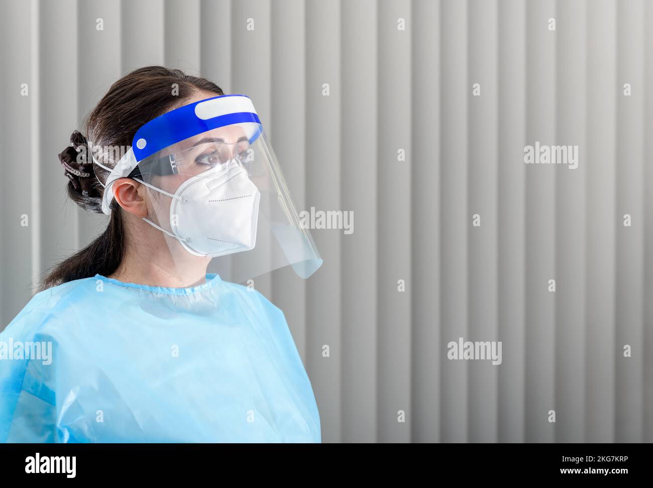 Doctor dressed up in personal protection equipment at hospital before ...