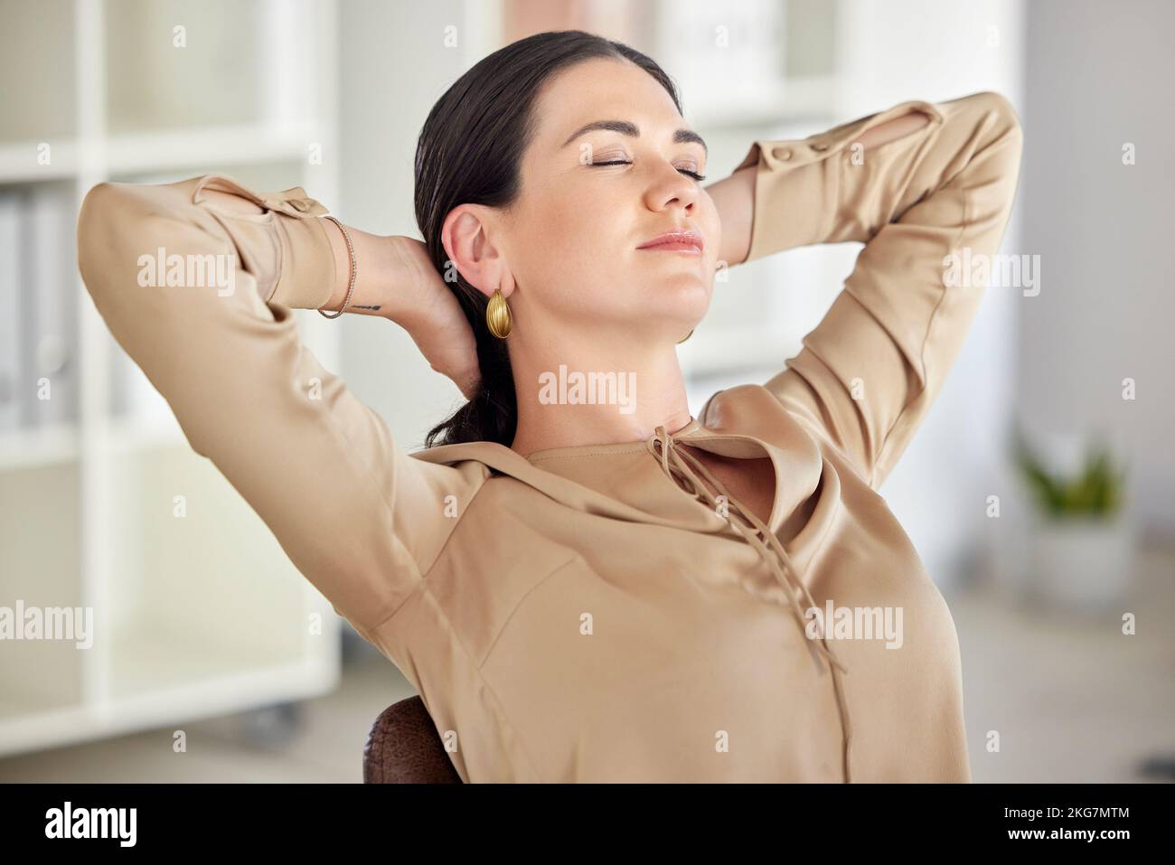 Businesswoman, relax and rest after productivity at office with hand ...