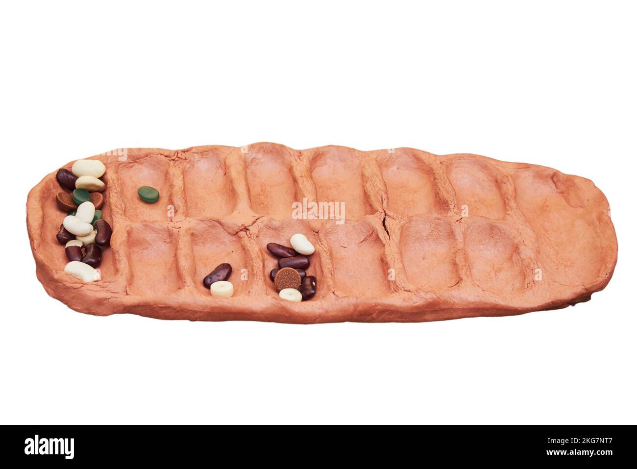 African game of kalah, popular in ancient Rome, isolated on a white ...