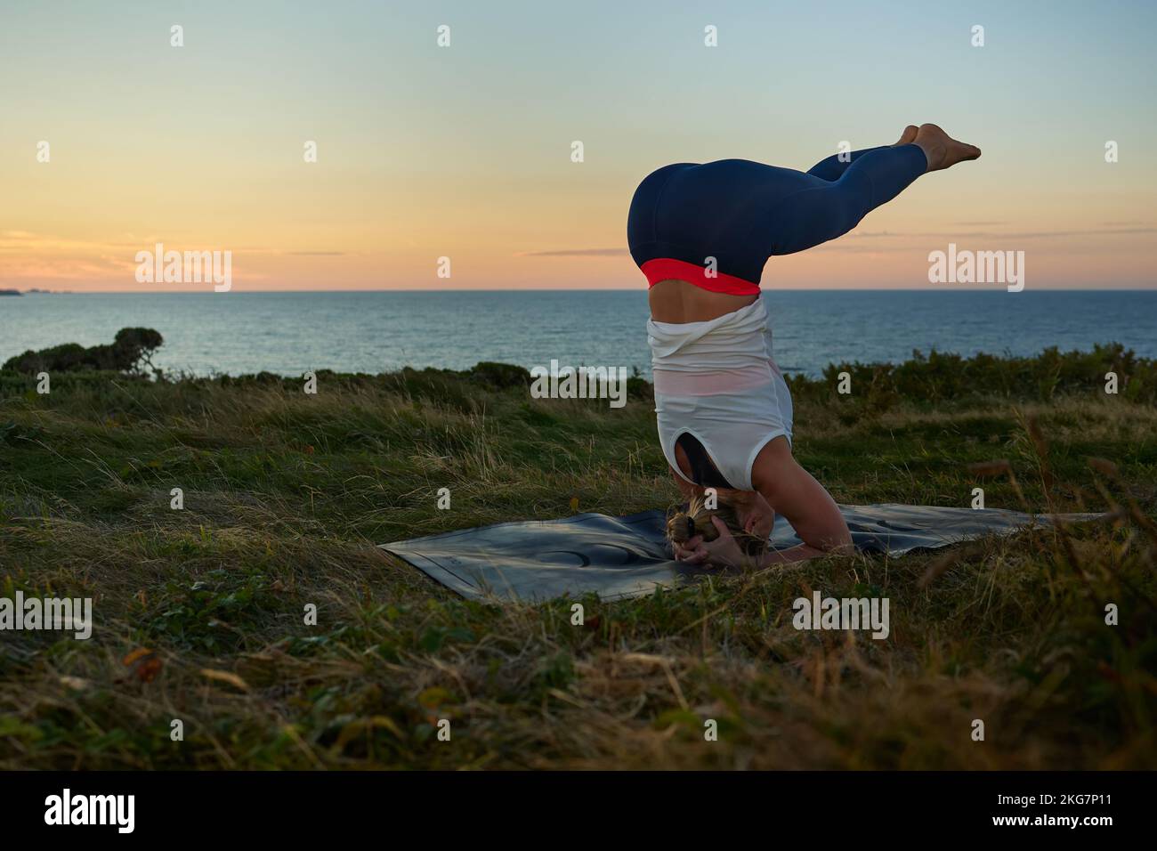 Athletic woman performing inverted hi-res stock photography and images ...