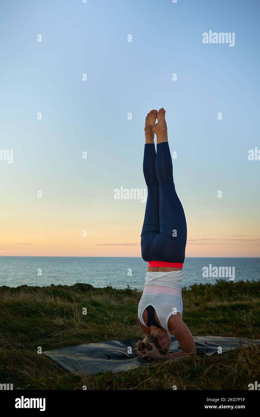 Athletic woman performing inverted hi-res stock photography and images ...