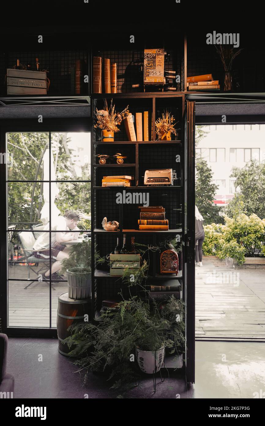 Books on shelves in restaurant and library Stock Photo - Alamy