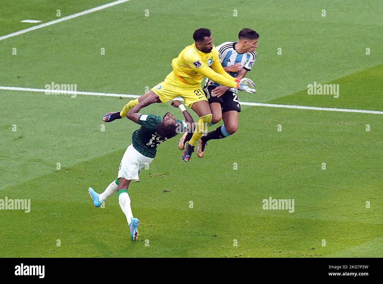 Saudi Arabia goalkeeper Mohammed Al-Owais punches the ball clear as he ...