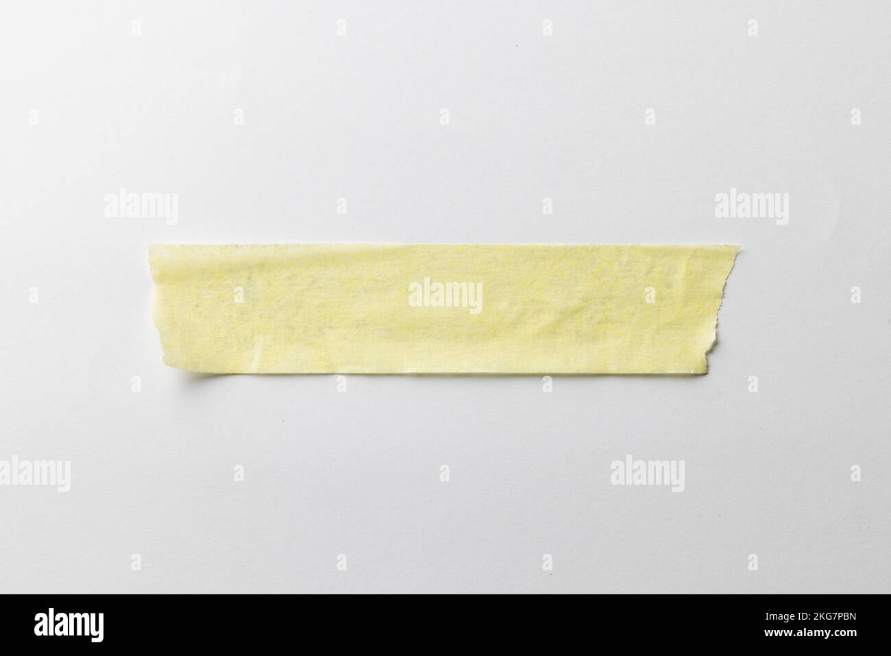 Yellow masking tape and copy space on white background Stock Photo - Alamy