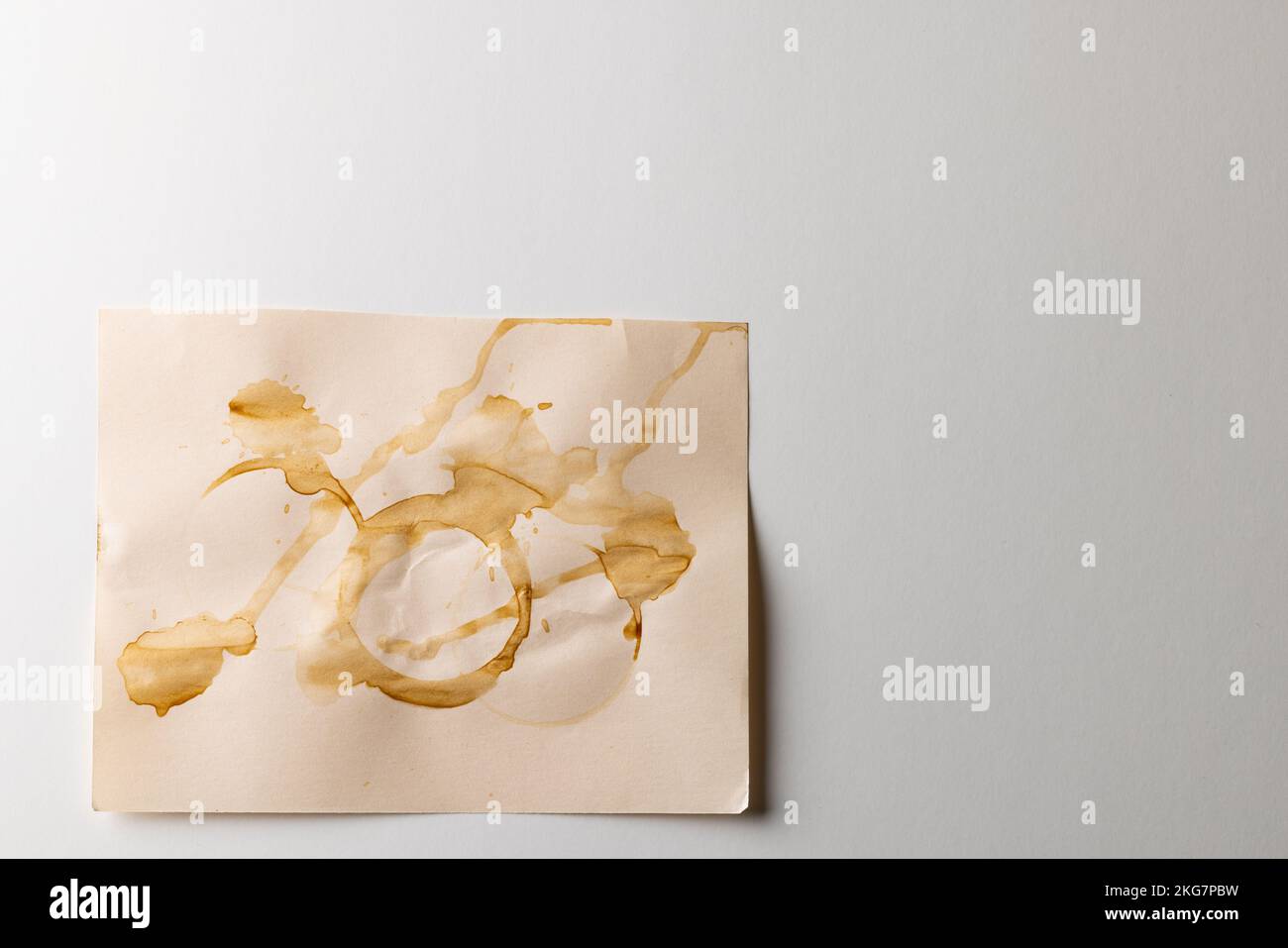 Yellow stained memo note with copy space on white background Stock ...