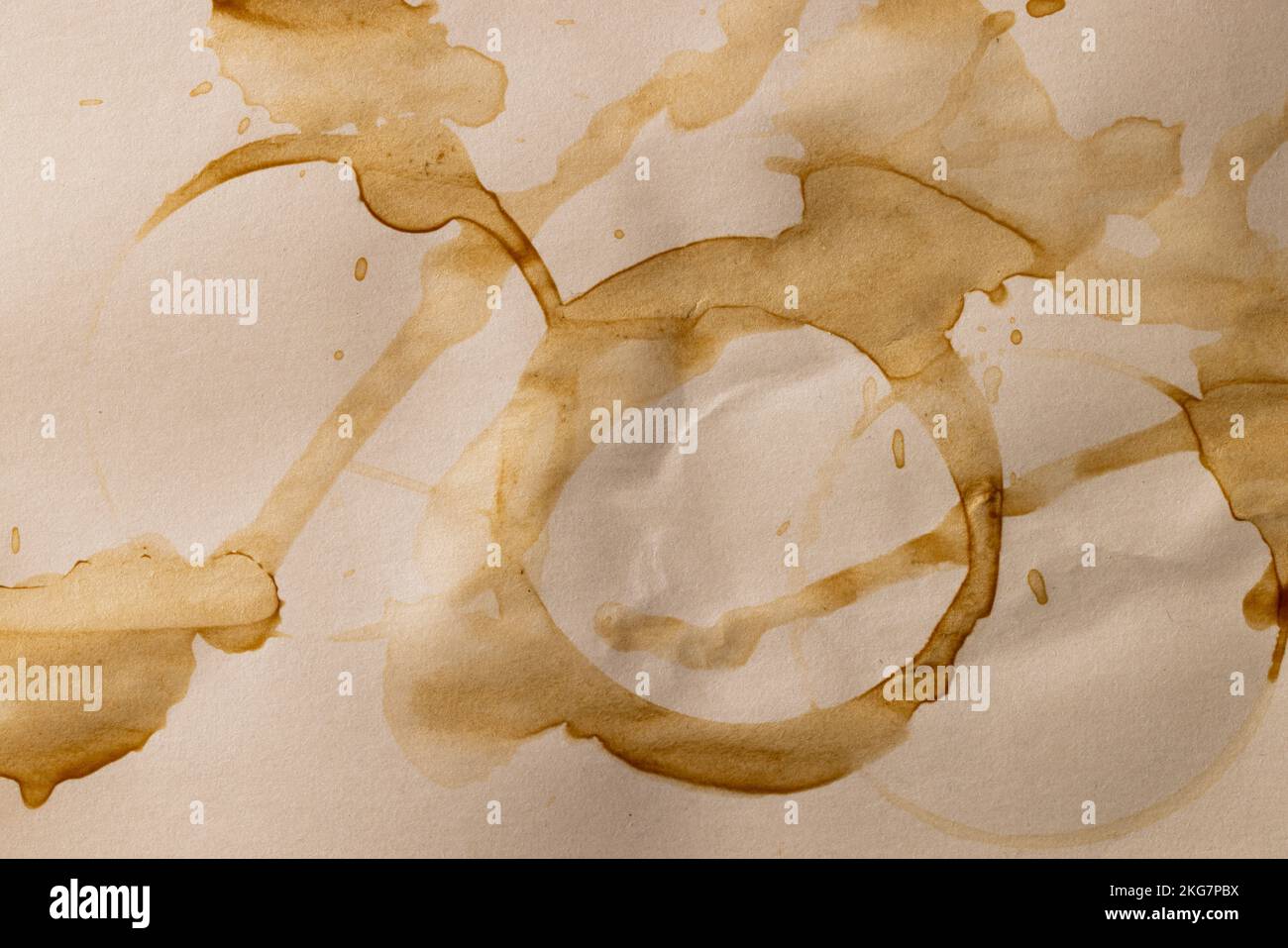 Yellow stained with coffee memo note on white background Stock Photo ...
