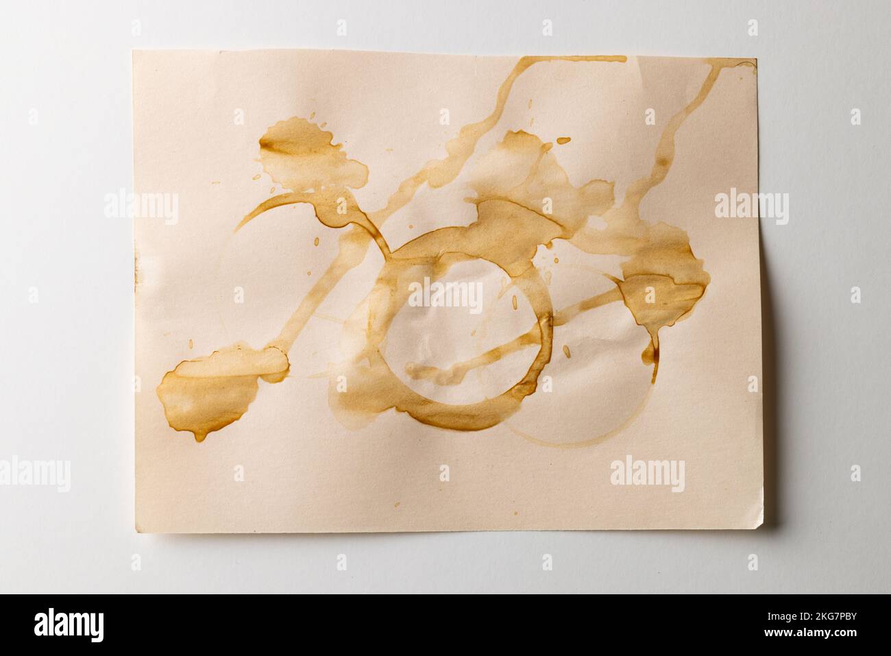 Yellow stained memo note with copy space on white background Stock ...