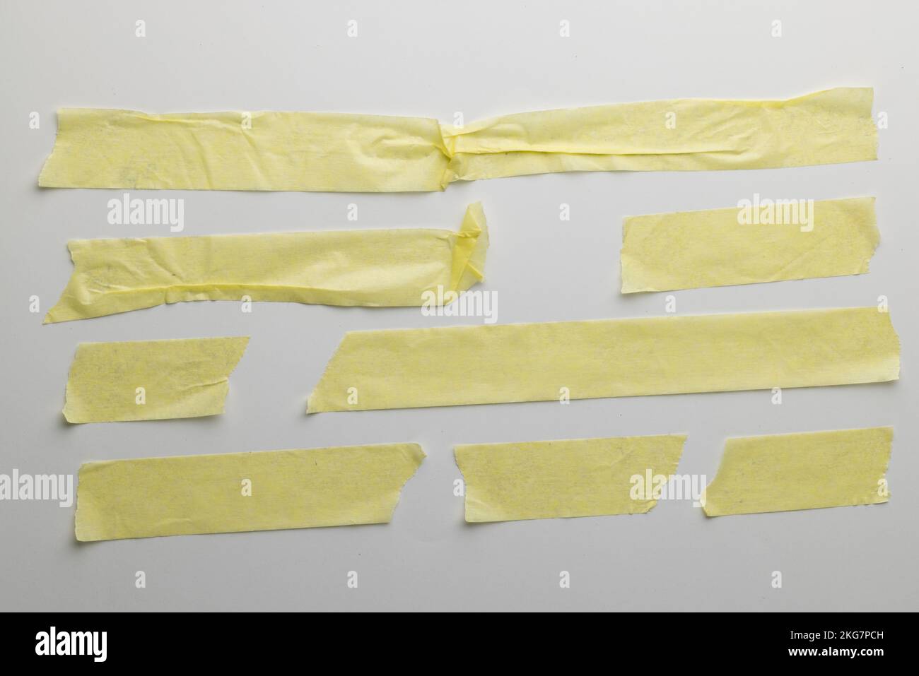 Yellow masking tape with copy space on white background Stock Photo - Alamy