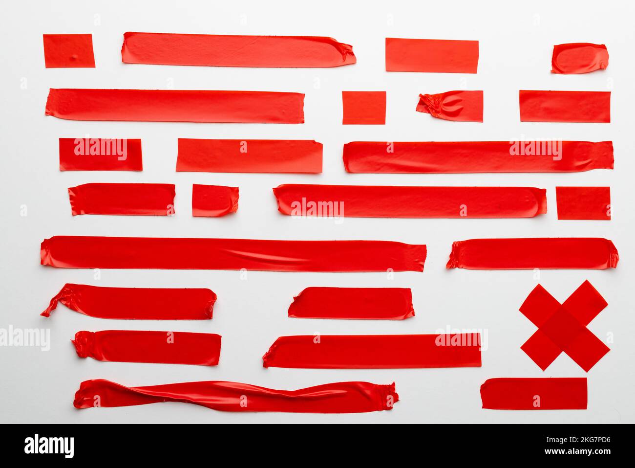 Ripped up pieces of red tape with copy space on white background Stock ...