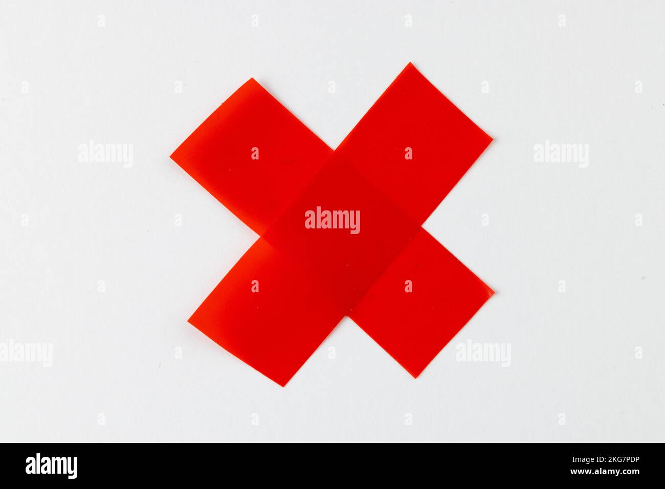 Cross shape red tape with copy space on white background Stock Photo ...