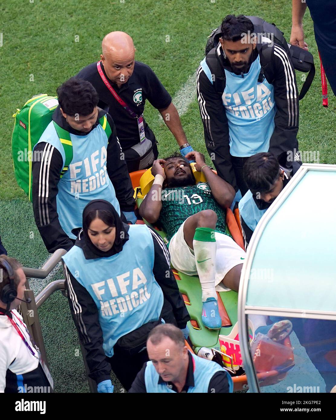 Saudi Arabia's Yasser Al-Shahrani leaves the pitch on a stretcher ...