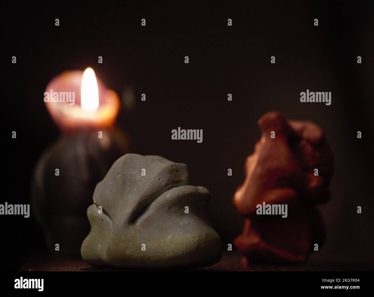 Candles from human faces figures Stock Photo - Alamy