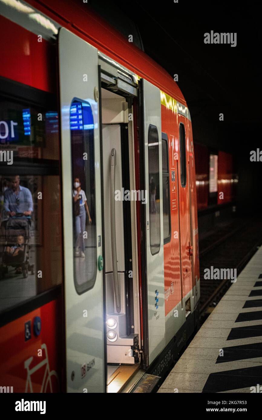 A train with open doors at the station, the S-Bahn Underground in ...
