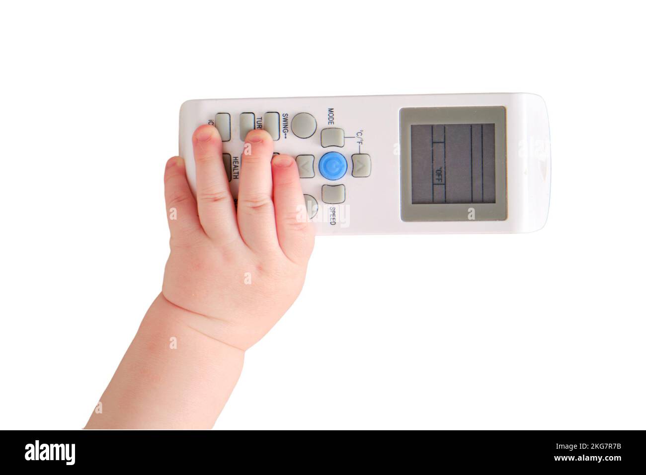 Baby toddler boy holds the air conditioner remote control in his hand ...