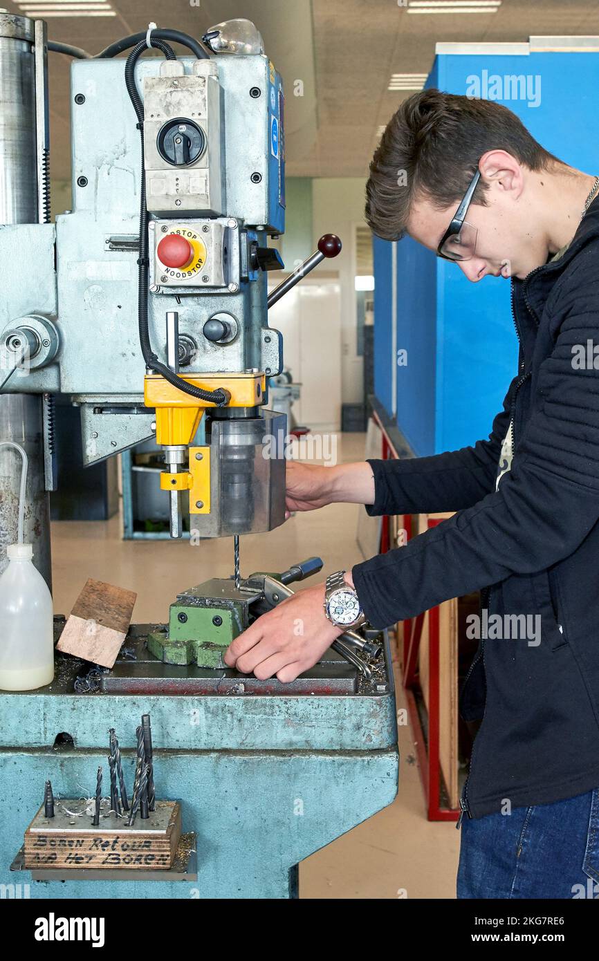 secondary school student working with a drill . 2018 holland ...