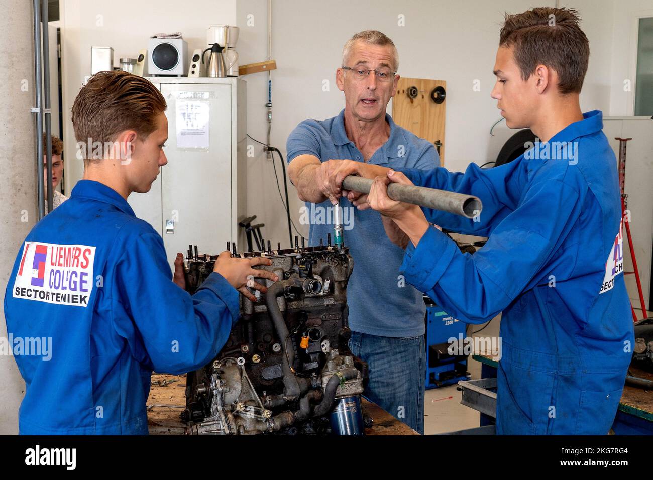 secondary school student working on a car engine. 2018 holland ...