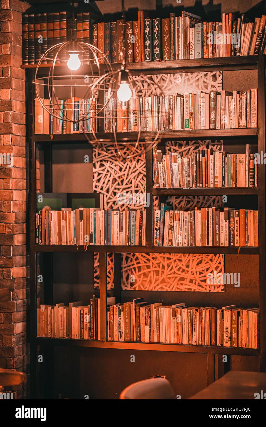 Books on shelves in restaurant and library Stock Photo - Alamy