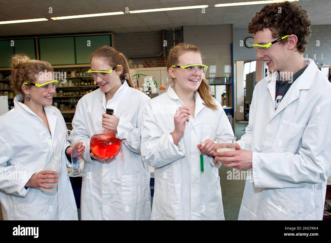 Students working in a chemistry classroom in a secondary school ...