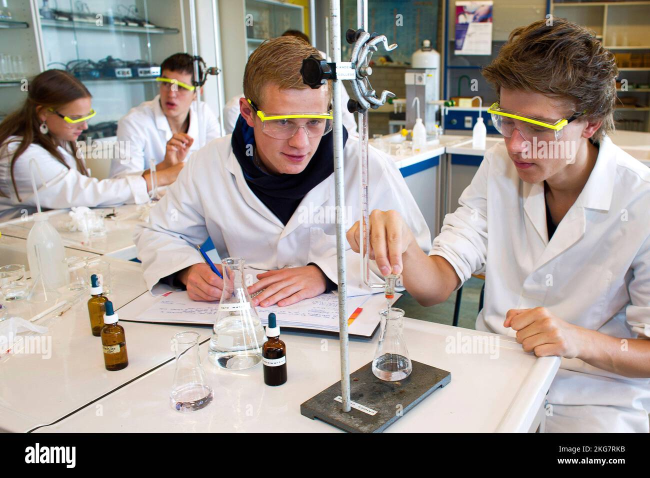 Students working in a chemistry classroom in a secondary school ...