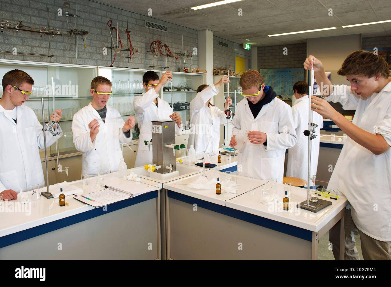 Students working in a chemistry classroom in a secondary school ...