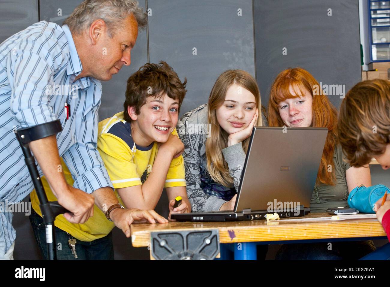 Teacher with students in a classroom in a secondary school. Holland ...