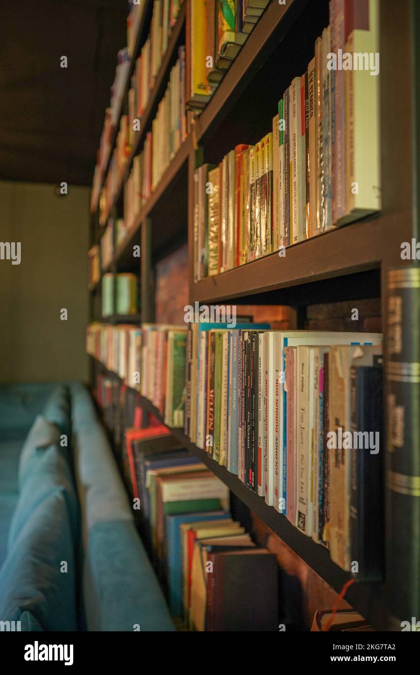 Books on shelves in restaurant and library Stock Photo - Alamy