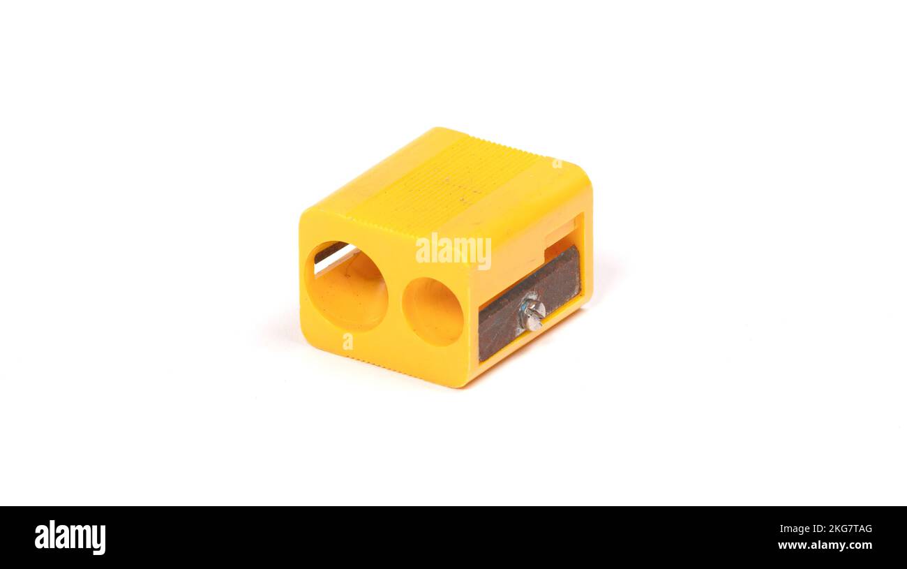 Close up old yellow pencil sharpener, isolated on white background ...