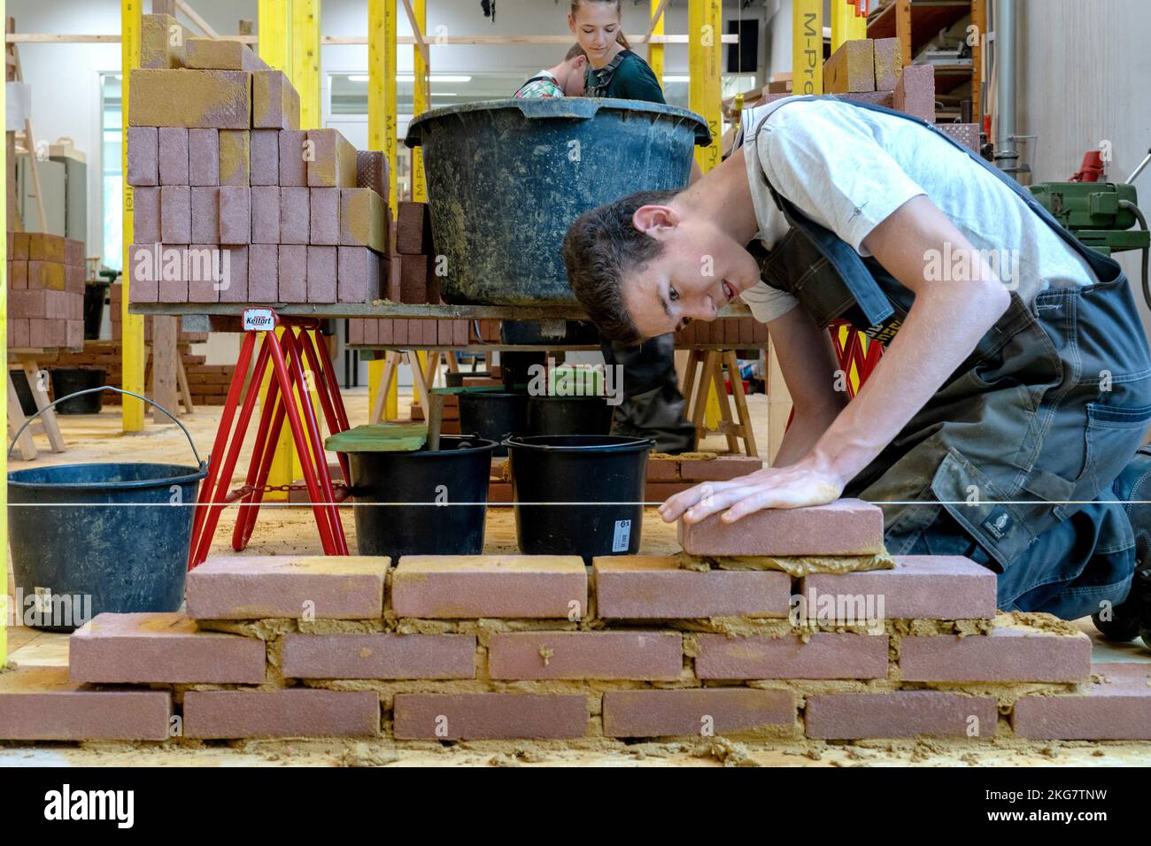 secondary school student laying bricks in masonry workshop. 2018 holland. vvbvanbree fotografie ...