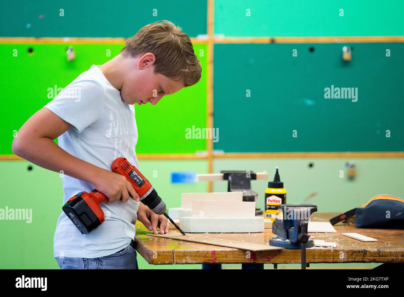 Student working with a drill in the technasium of a secondary school ...