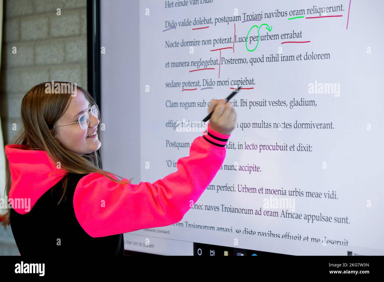 Student working with a digital whiteboard in a classroom in a secondary ...