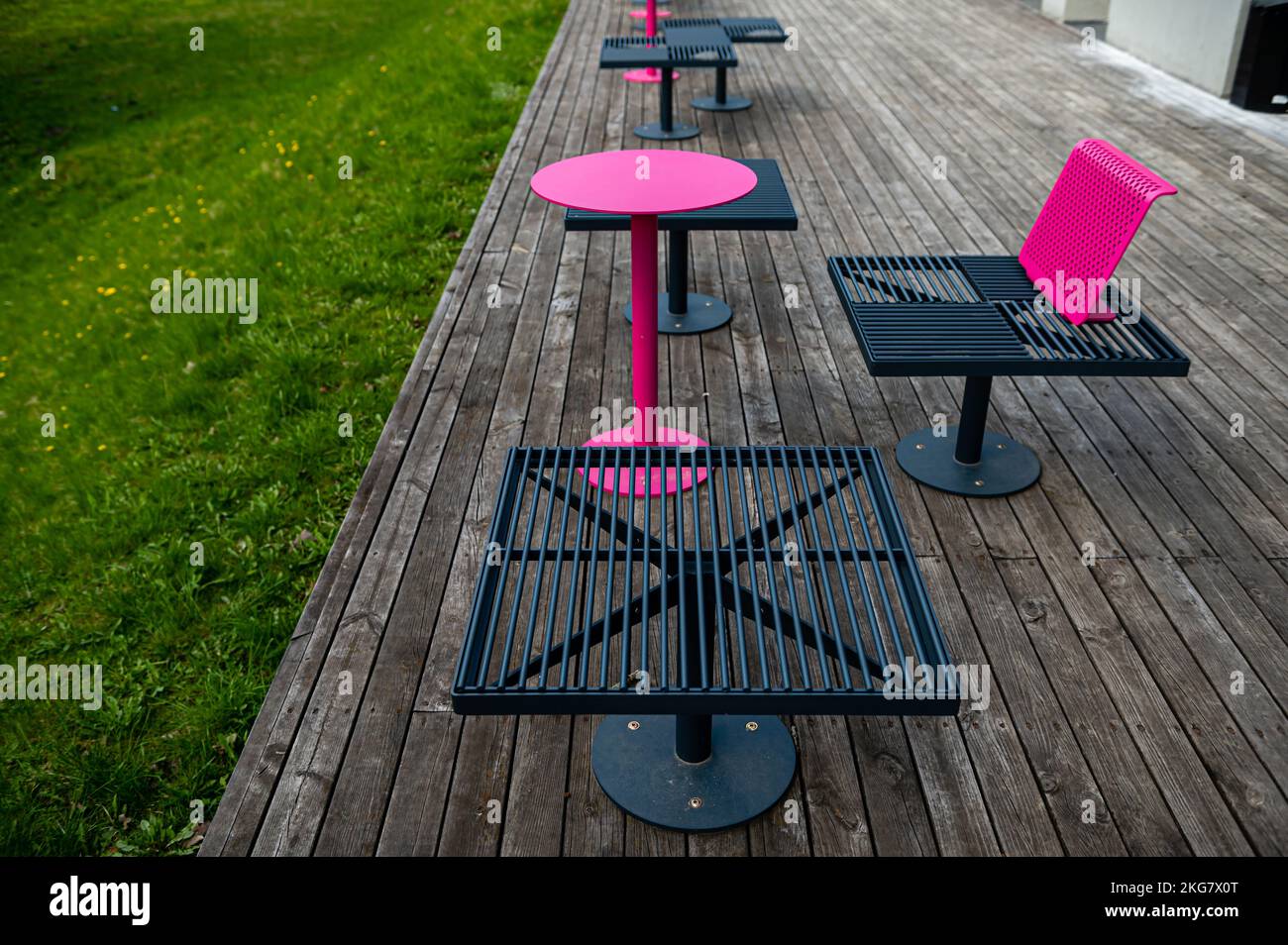 colorful metal benches and tables on the terrace on a sunny day Stock ...