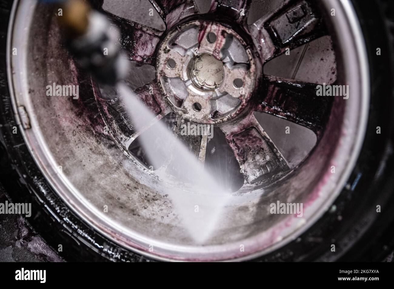 The red fluid reacts with dirt on the car's rim Stock Photo - Alamy