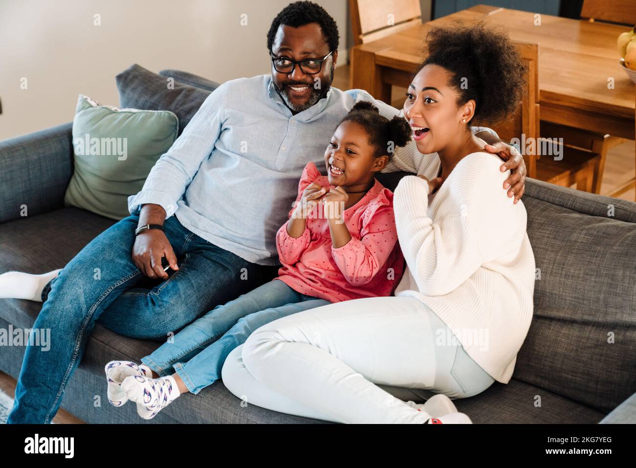 African american family woman and man with little daughter smiling and ...