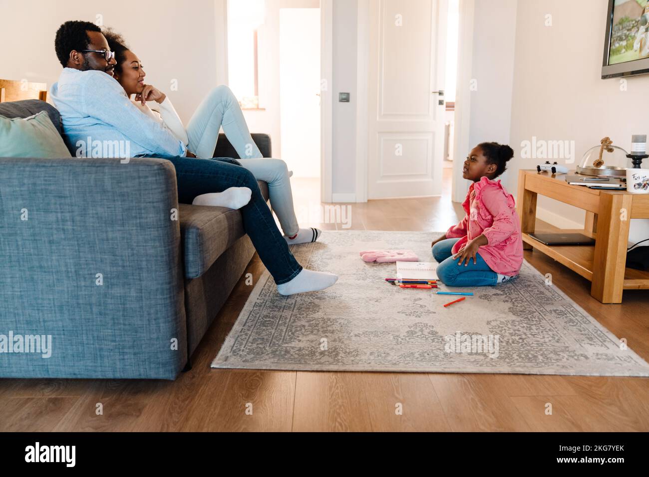 African american family woman and man with little daughter smiling and ...