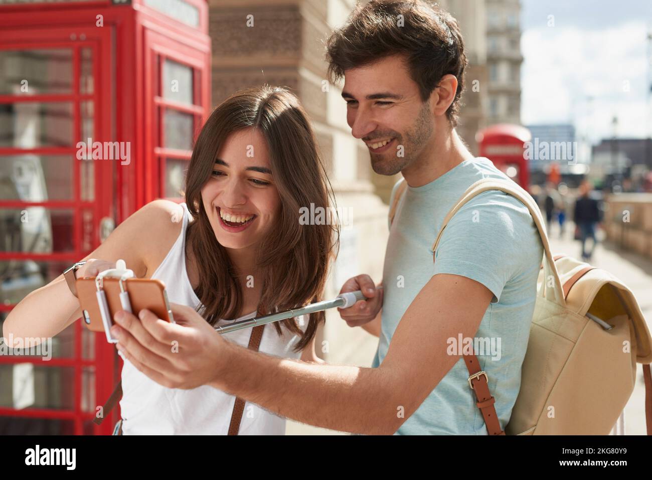 Travel, selfie and couple in London city on smartphone, social media ...