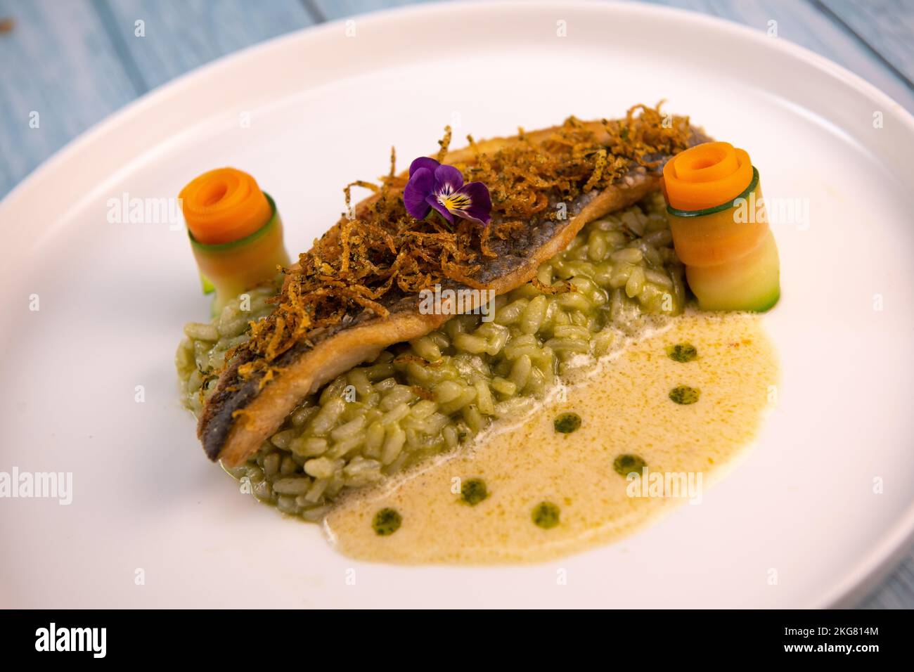 Recipe for fried fillet of sea bass with herb risotto, white wine sauce ...
