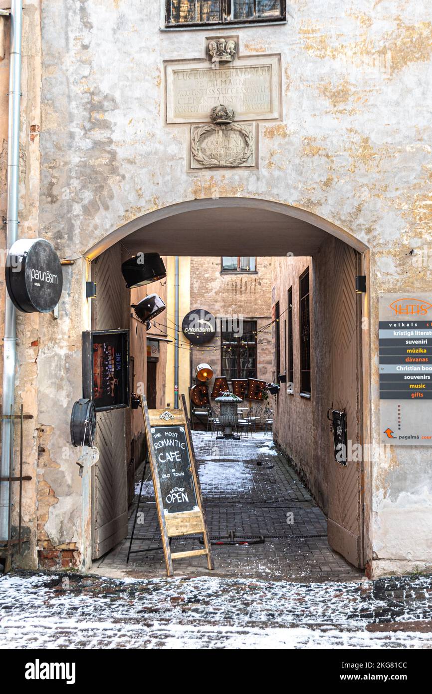Entrance with signboard of a cozy cafe in Riga old town, Latvia, in ...