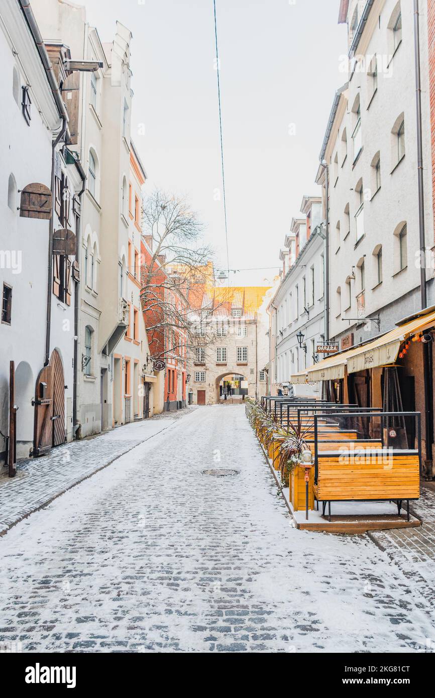 Beautiful narrow street with cobblestones in Riga Old Town with houses ...