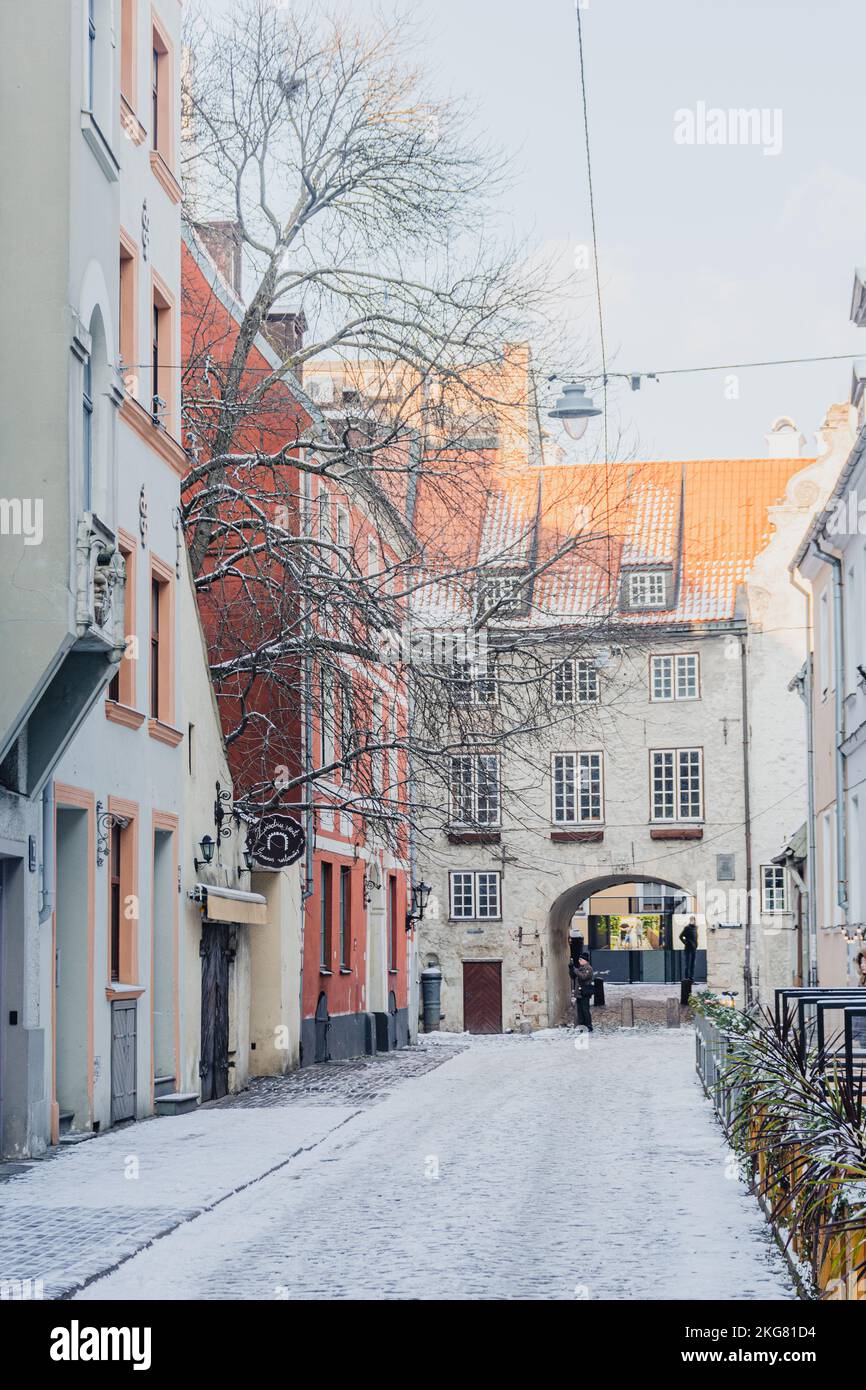 Beautiful narrow street with cobblestones in Riga Old Town with houses ...