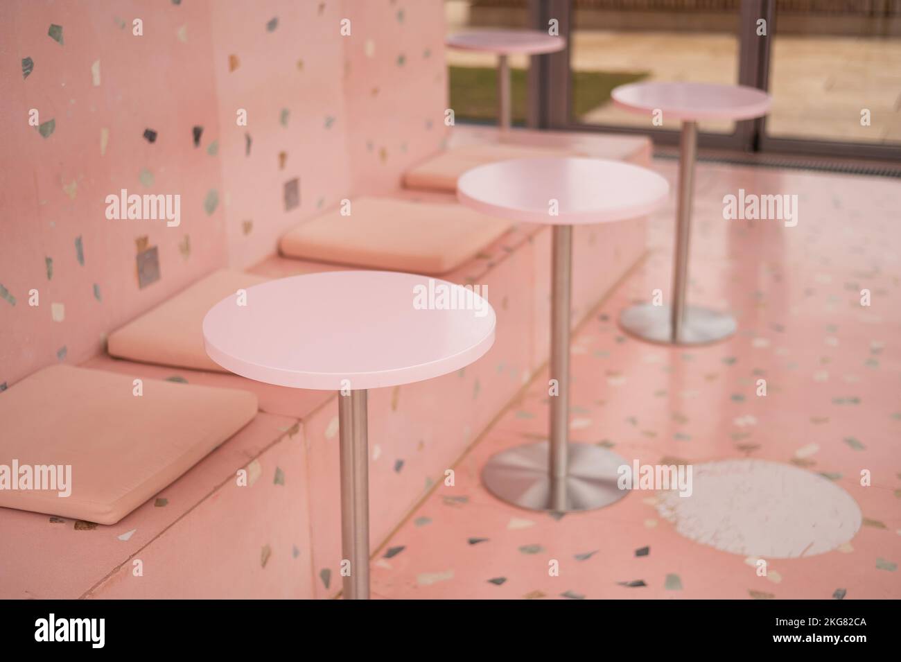 Empty pink bar tables in an ice cream parlour Stock Photo - Alamy