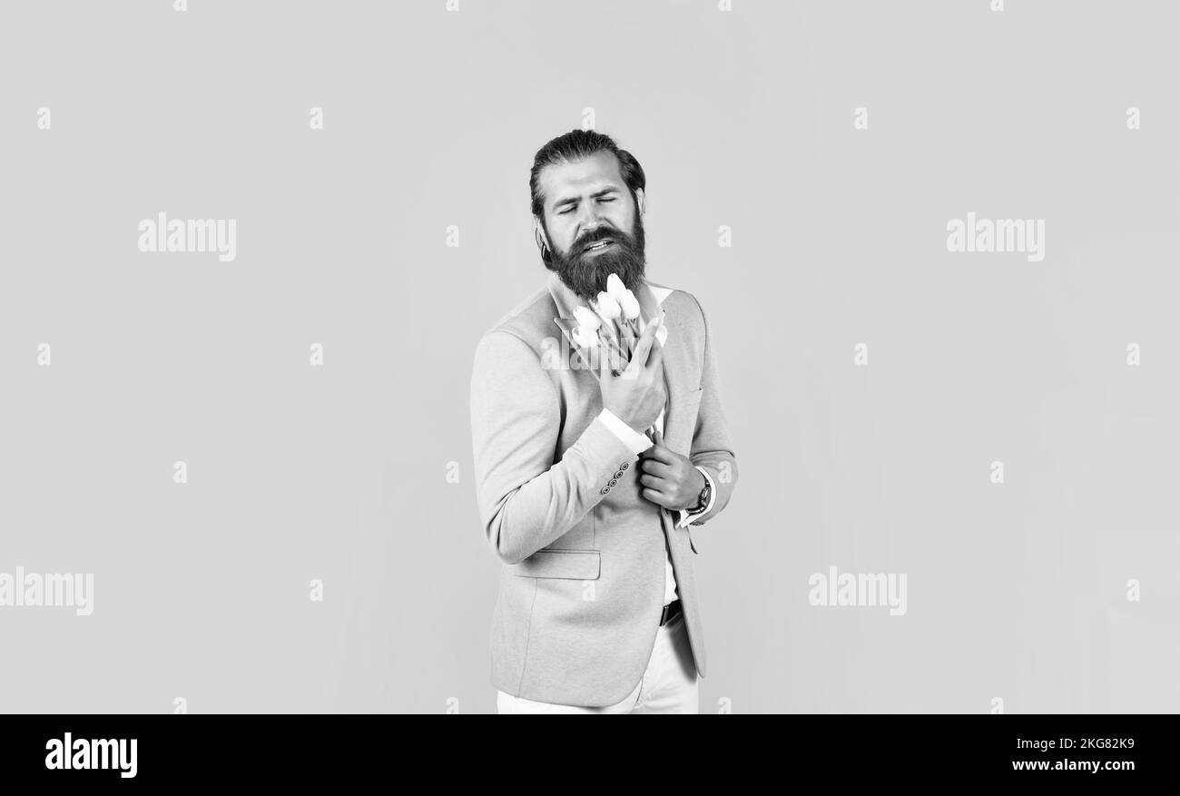 spring present. true gentleman with bouquet. love date concept. bearded ...
