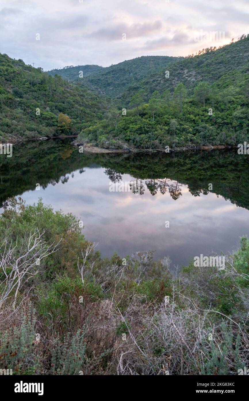 Vanadal water retention wiith clouds reflecting in the water, in la ...