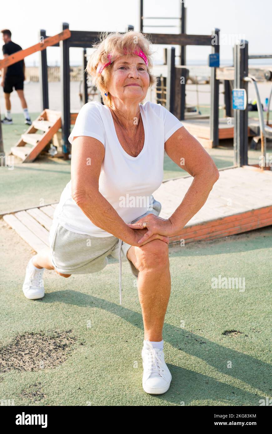 Old woman doing fitness exercises outdoors Stock Photo - Alamy