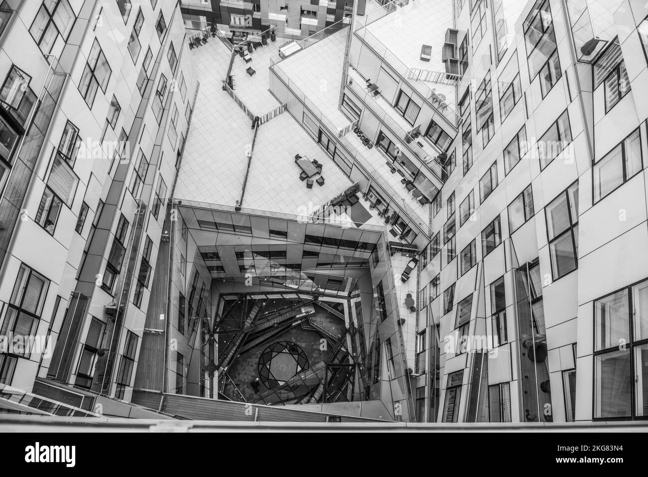 A high angle view of street surrounded by buildings in black and white ...