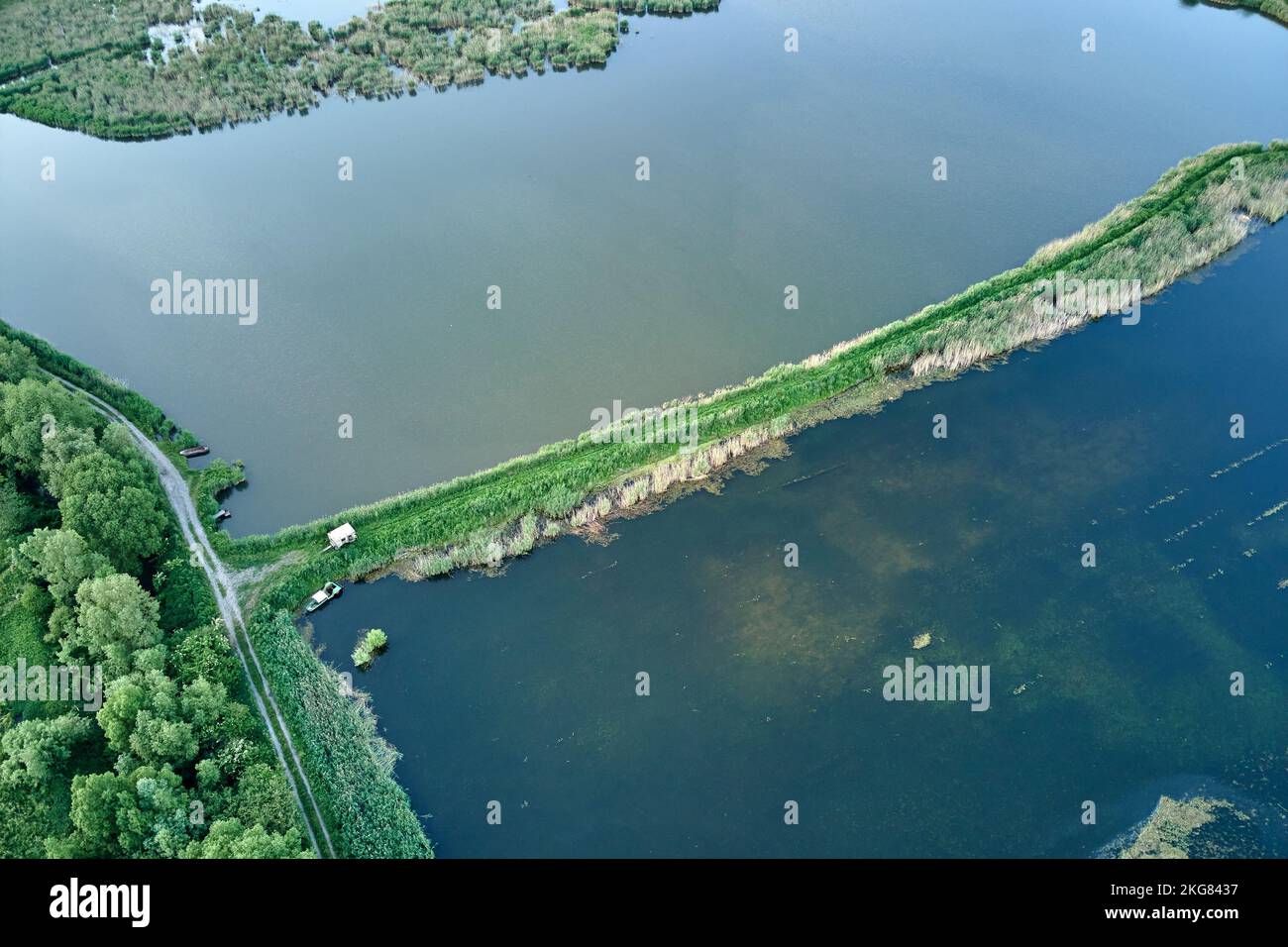 Aerial view of fish hetching pond with blue water in aquacultural area ...